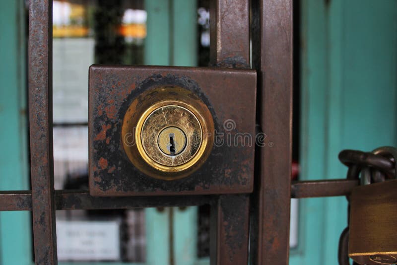 A Keyhole on the Grate of a Closed Shop with a Green Door. a Locked ...