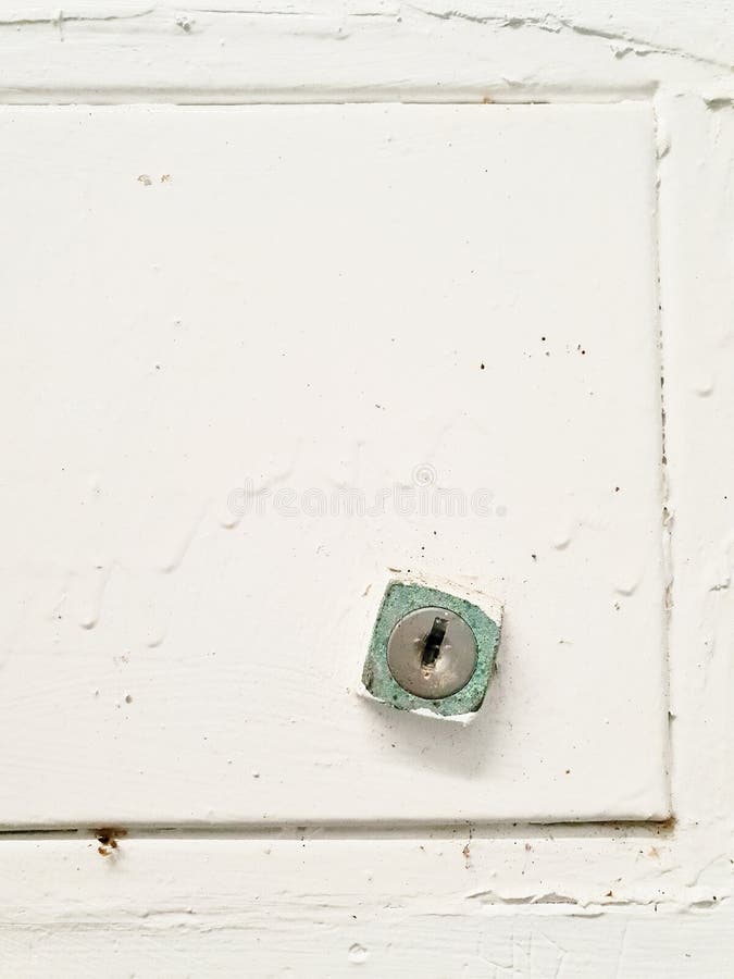 A Keyhole on a White Metal Door Stock Photo - Image of entry, prevent ...