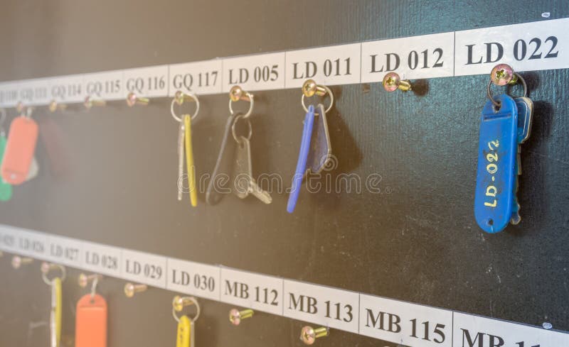 Keys Chain Hanging on the on the Black Wood Plate Stock Photo - Image ...