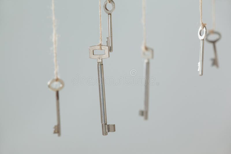 Keys hanging on strings stock image. Image of steel, security - 84069215