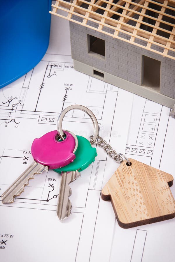 Keys with Home Shape and Small House Under Construction with Electrical ...