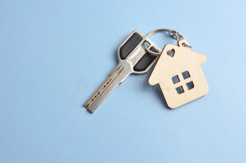 Keychain in the Shape of a House with a Key in the Hands of a Person ...
