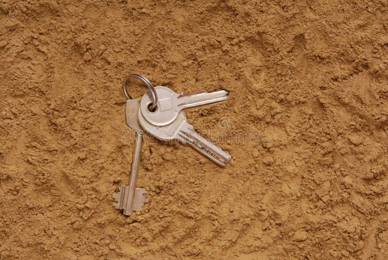 Keys are on the sand stock photo. Image of sand, metal - 130022874