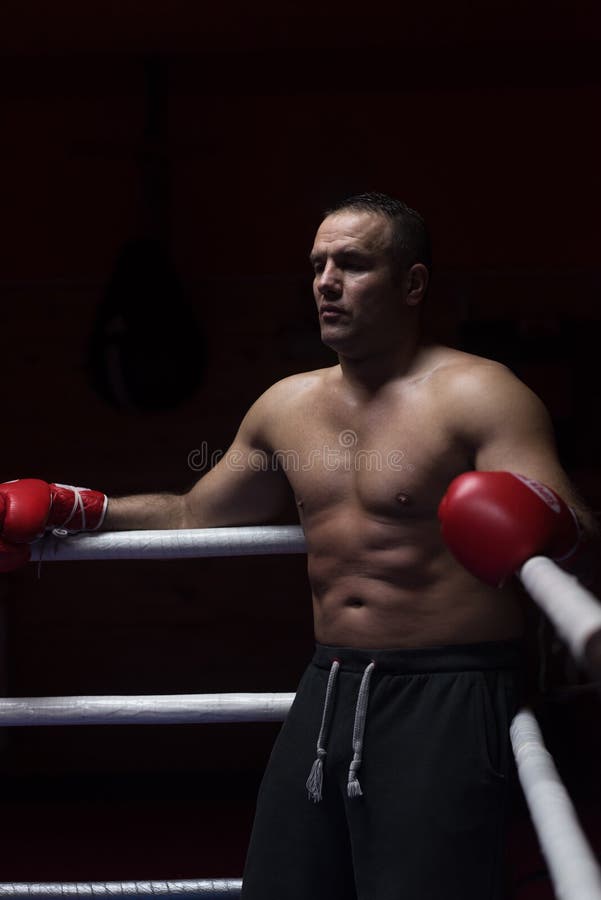 Kick Boxer Resting on the Ropes in the Corner Stock Photo - Image of ...