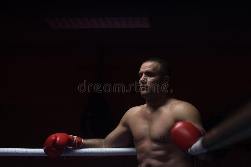 Kick Boxer Resting on the Ropes in the Corner Stock Image - Image of ...