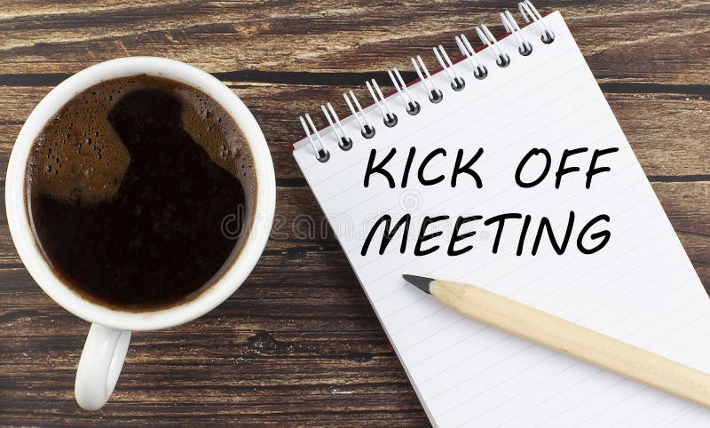 KICK OFF MEETING Text on Notebook with Coffee on the Wooden Background ...