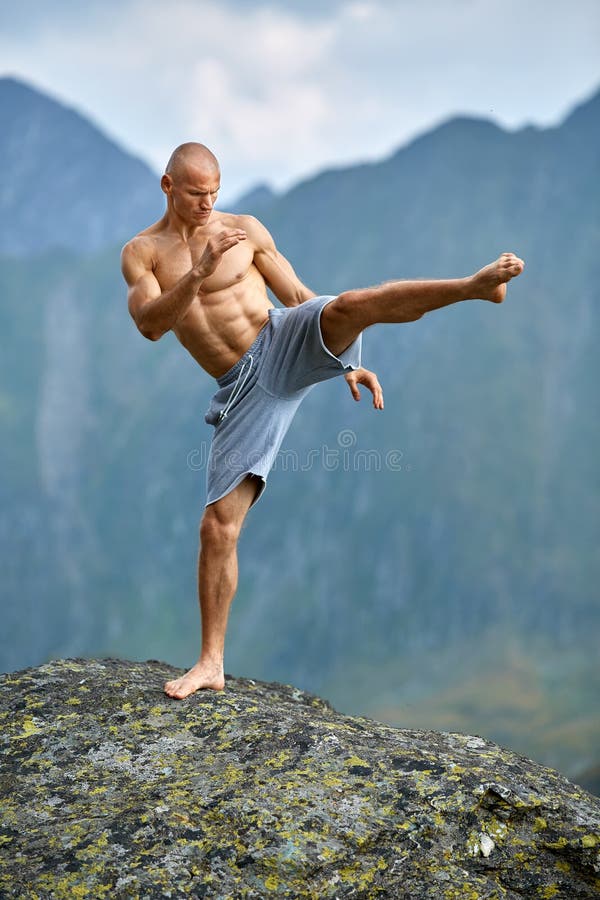 Kickboxer or Muay Thai Fighter Training on a Mountain Cliff Stock Photo ...