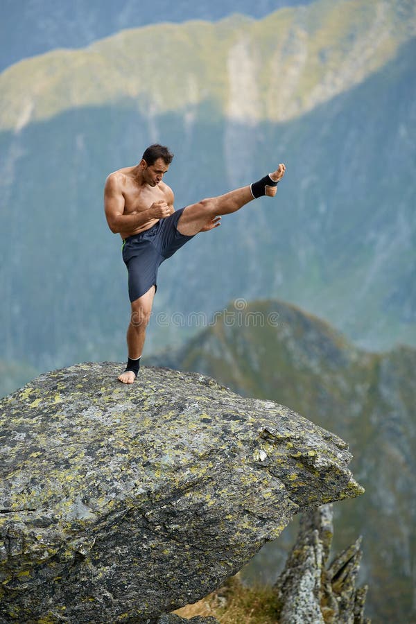 Kickboxer or Muay Thai Fighter Training on a Mountain Cliff Stock Photo ...