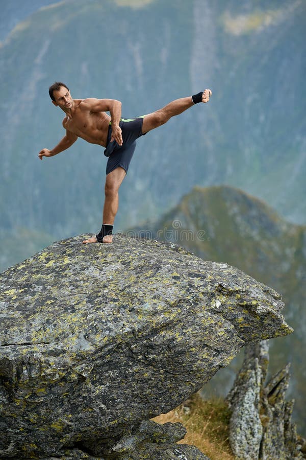 Kickboxer or Muay Thai Fighter Training on a Mountain Cliff Stock Image ...