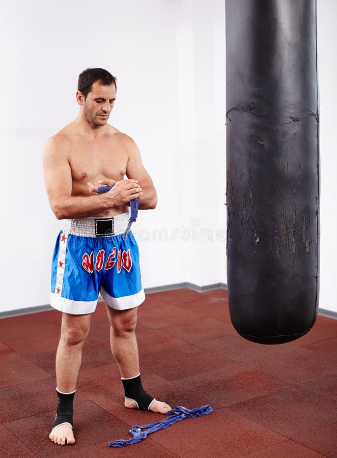 Kickboxer with punch bag stock photo. Image of activity - 44552050