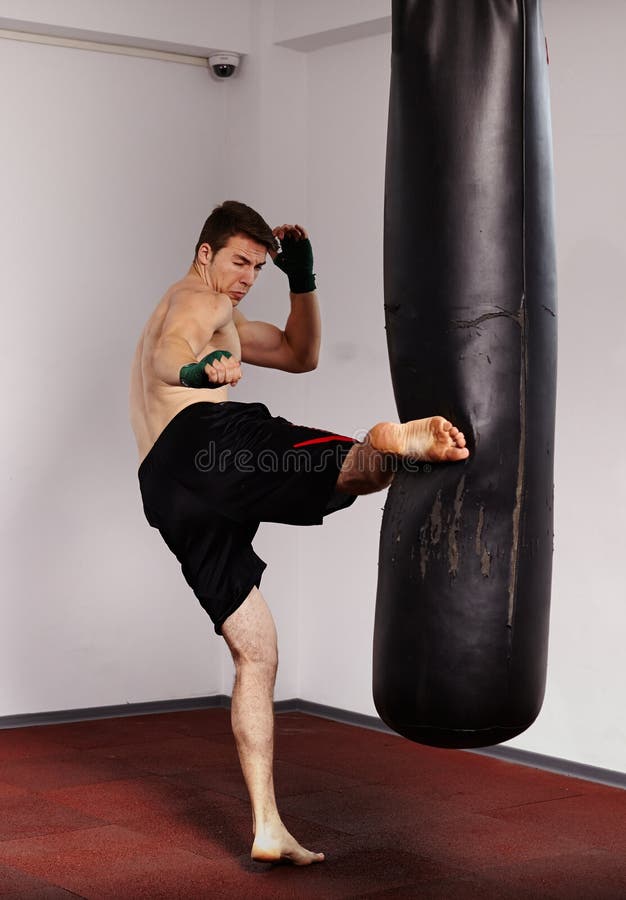 Kickboxer with punch bag stock image. Image of adult - 44552069