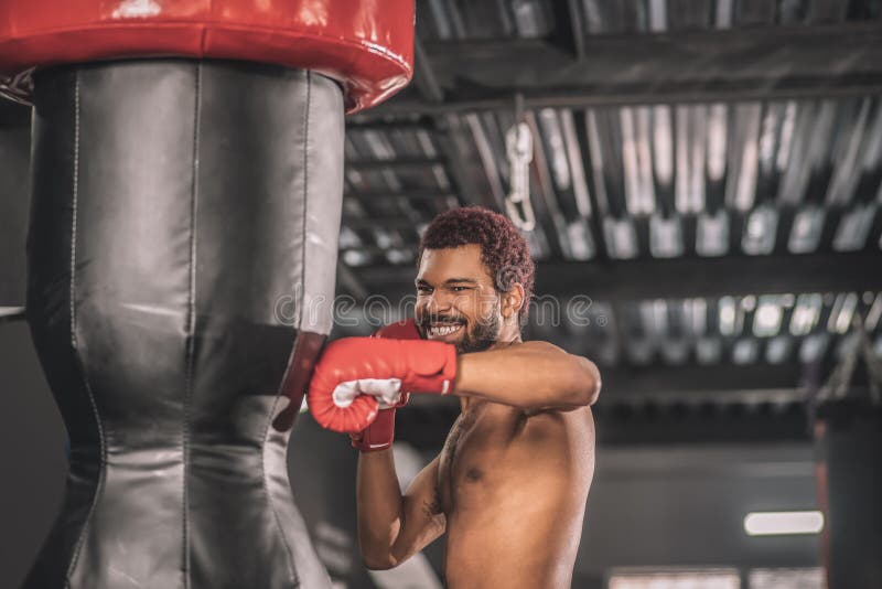Young Dark-skinned Kickboxer Having a Workout in a Gym Stock Image ...