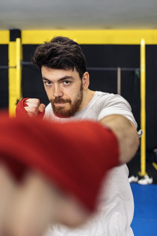 Kickboxing Fighter Performing Punches Looking at Camera at the Gym ...