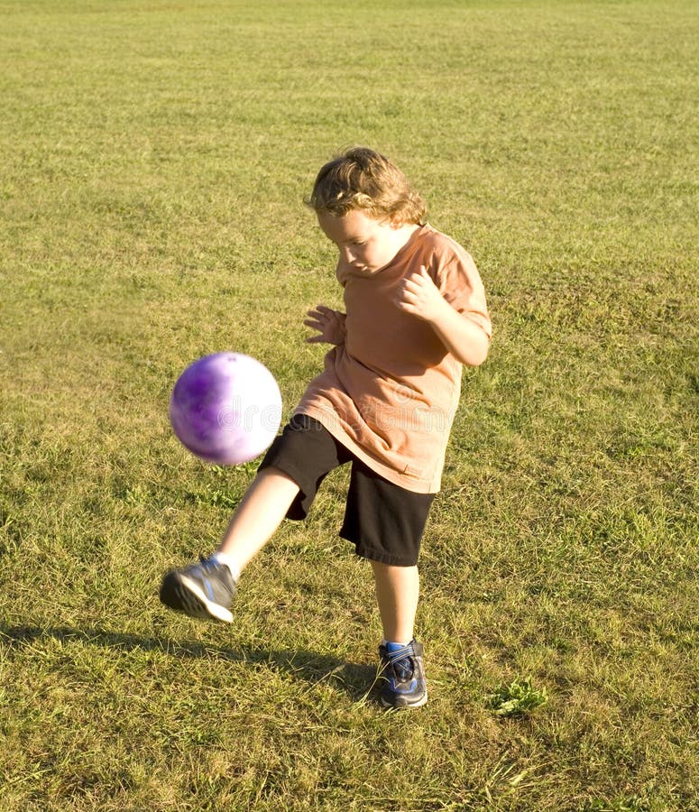 Kicking the Ball stock photo. Image of kicking, grass - 10835480
