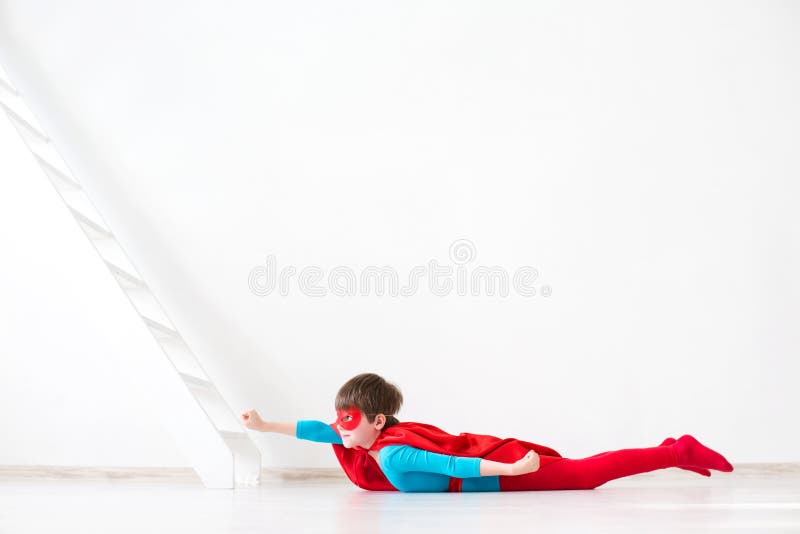 Kid As Superman Dressed in Flight Position. Stock Photo - Image of ...