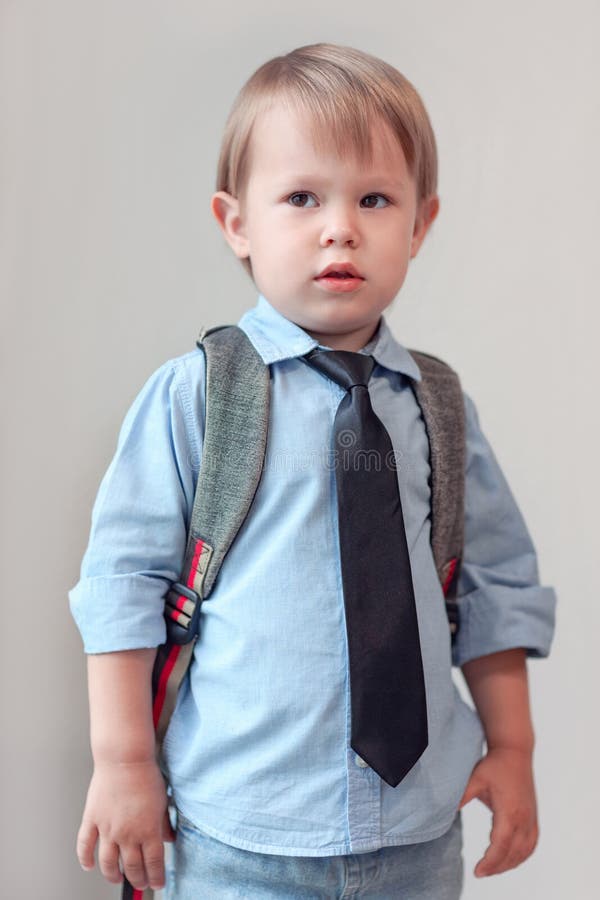 A Kid with a Backpack, a Child in a Shirt and Tie is Getting Ready for ...