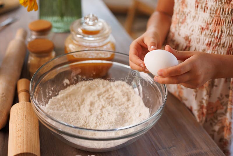 Kid Baking, Holding Egg Over Flour in Mixing Bowl, Warm Rustic Kitchen ...