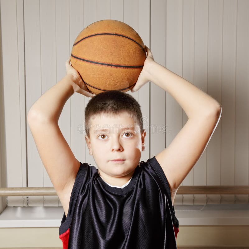 Kid with Basketball Over Head Stock Image - Image of male, orange: 22532701