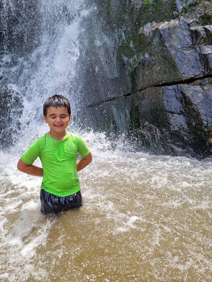 Kid Bathing in a Waterfall with Eyes Closed Stock Image - Image of ...