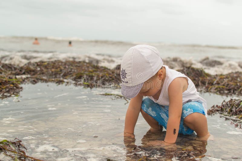 Kid on the Beach Near the Ocean Stock Photo - Image of beach, smile ...