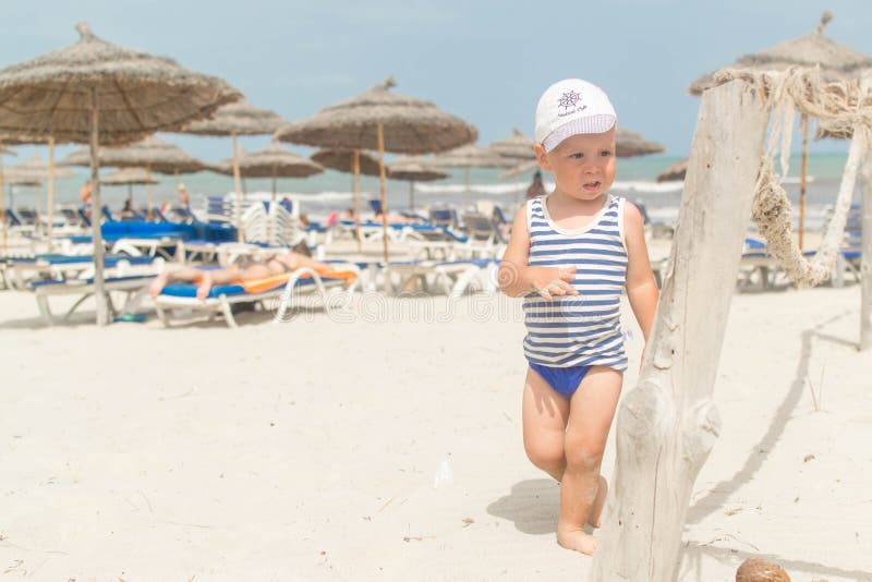 Kid on the Beach Near the Ocean Stock Photo - Image of summer, tropical ...