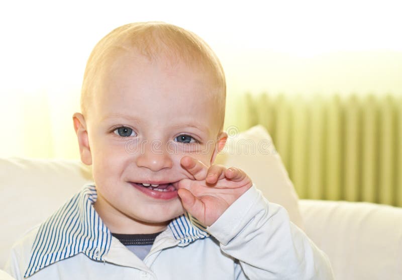 Kid biting his finger stock image. Image of child, nice - 17530079