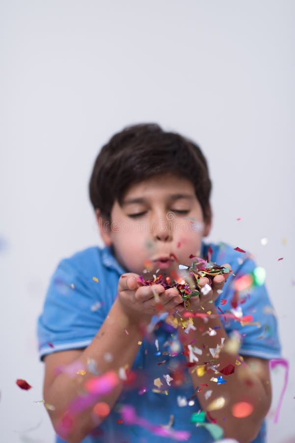 Kid blowing confetti stock image. Image of carnival, portrait - 88530689
