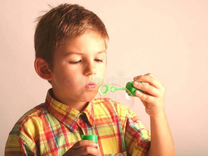 Kid Blowing Soap Bubbles stock photo. Image of bubbles - 268320 Kid Blowing Soap Bubbles stock photo. Image of bubbles - 268320