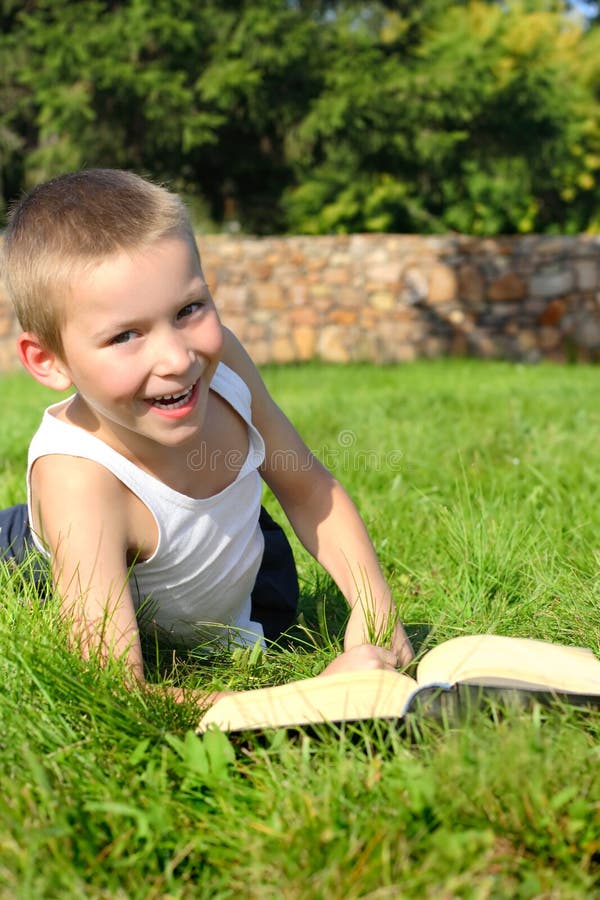 Kid with a book stock image. Image of summer, pleased - 12547885