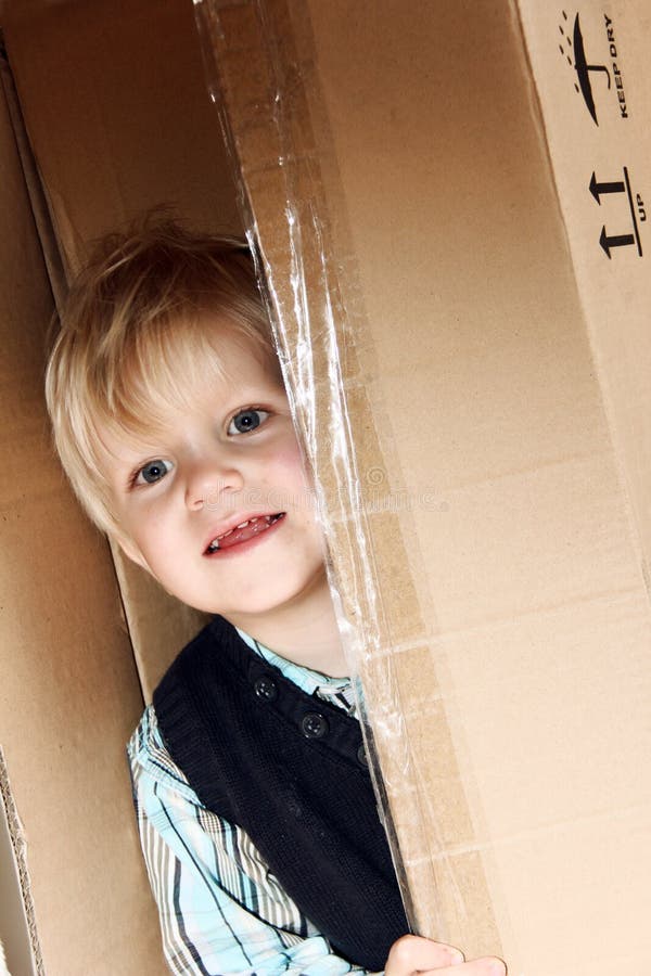 Kid in the box stock photo. Image of homour, cute, joke - 21943758