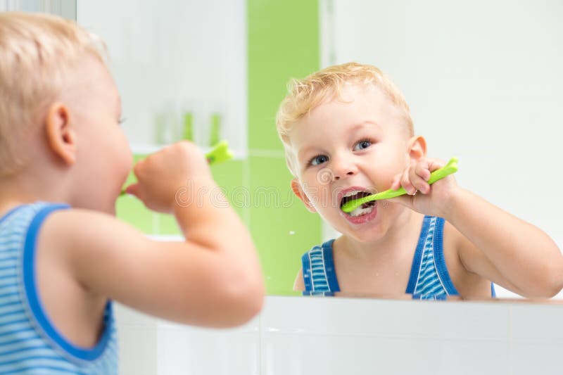 Kid boy brushing teeth stock image. Image of adorable - 33819067