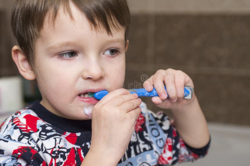 Kid Boy Brushing Teeth. Little Baby Boy with Tooth Brush Stock Photo ...
