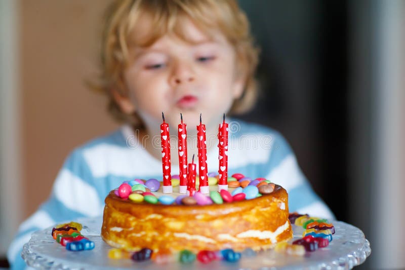 Kid Boy Celebrating His Birthday and Blowing Candles on Cake Stock ... Kid Boy Celebrating His Birthday and Blowing Candles on Cake Stock ...