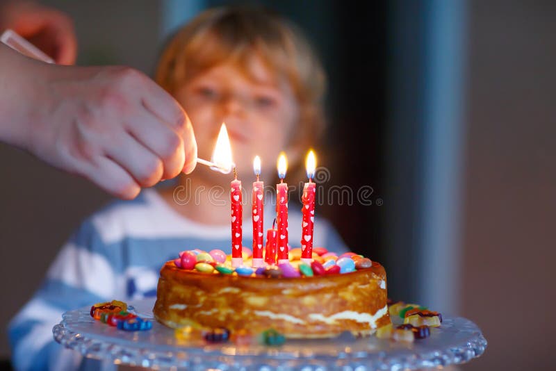Kid Boy Celebrating His Birthday and Blowing Candles on Cake Stock ... Kid Boy Celebrating His Birthday and Blowing Candles on Cake Stock ...