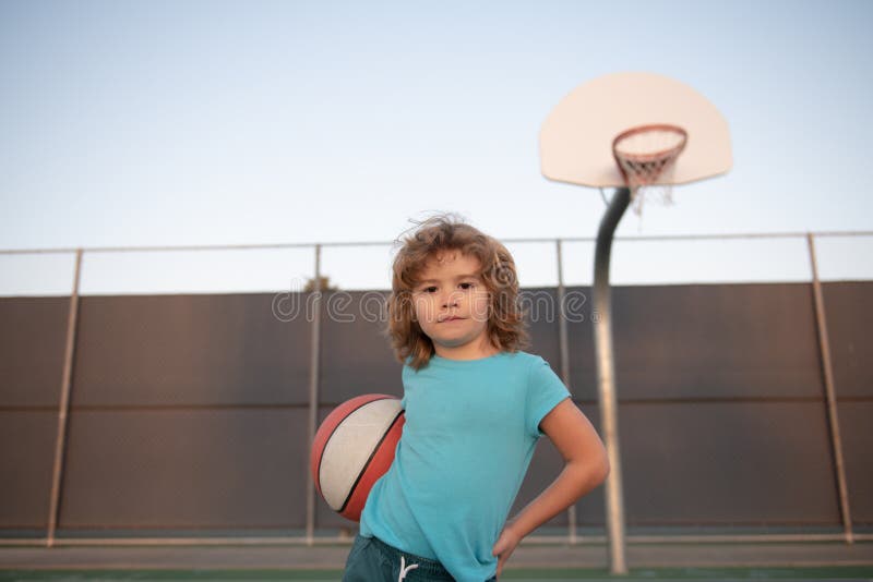 Kid Boy Child Concentrated on Playing Basketball. Stock Photo - Image ...