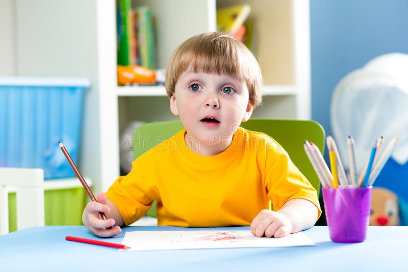 Kid Boy Drawing with Pencils at Table Stock Photo - Image of child ...