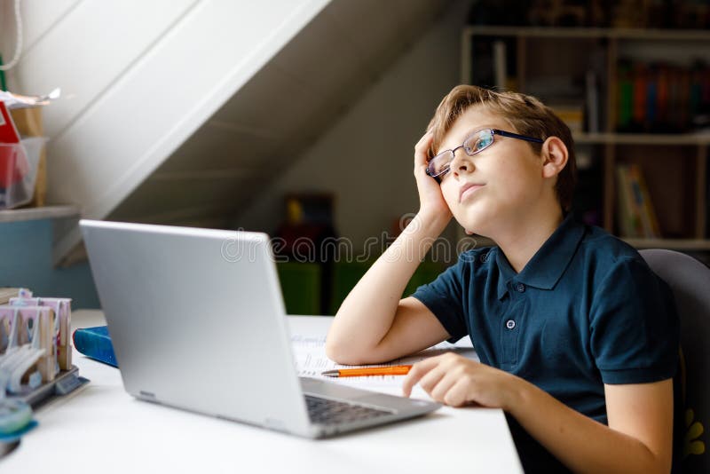 Kid Boy with Glasses Learning at Home on Laptop for School. Adorable ...