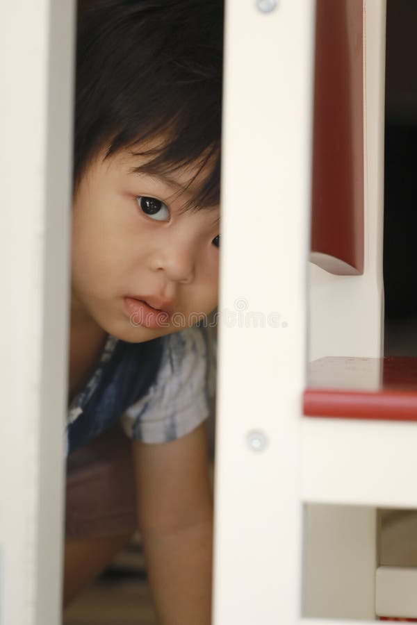 Kid Boy Looking for Something through the Door Stock Image - Image of ...
