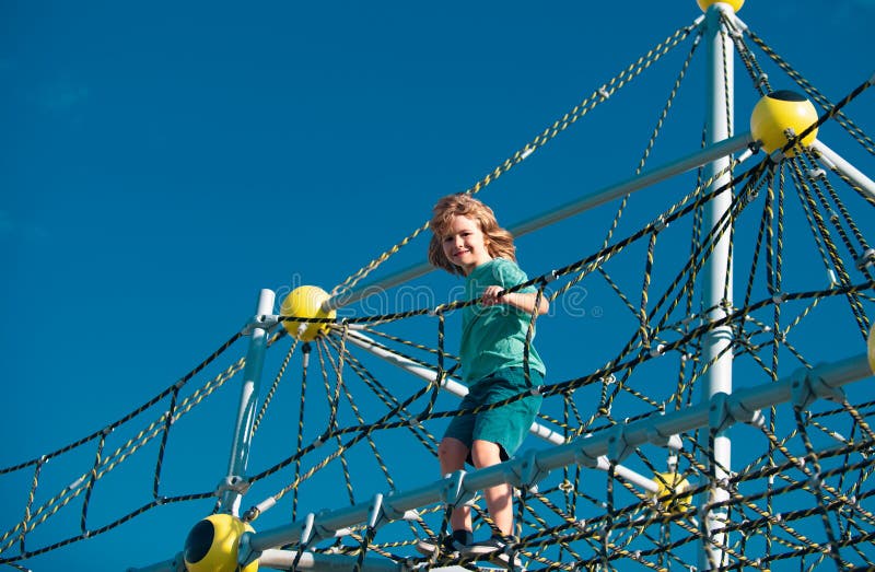 Kid Boy Playing on the Rope Outdoor Playground. Stock Photo - Image of ...