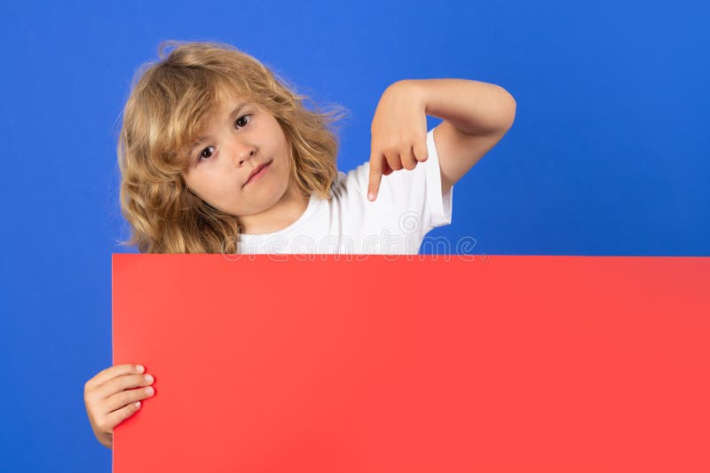 Kid Boy Points His Finger Down at Empty Space. Portrait of Child on ...