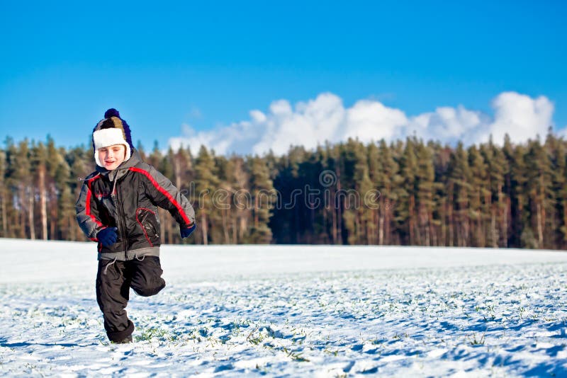 Kid boy running in winter stock photo. Image of healthy - 22644798