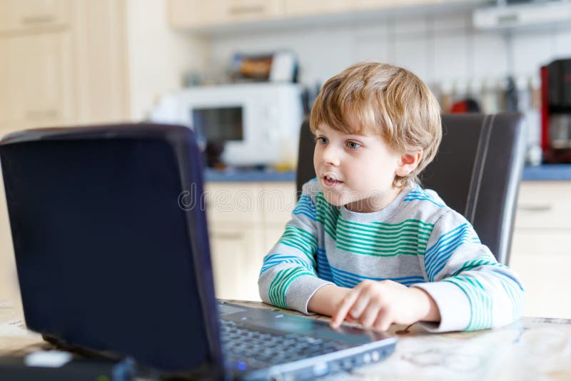 Kid Boy Surfing Internet and Playing on Computer Stock Photo - Image of ...