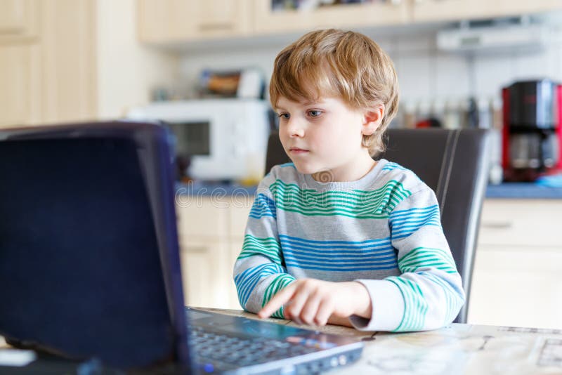 Kid Boy Surfing Internet and Playing on Computer Stock Photo - Image of ...