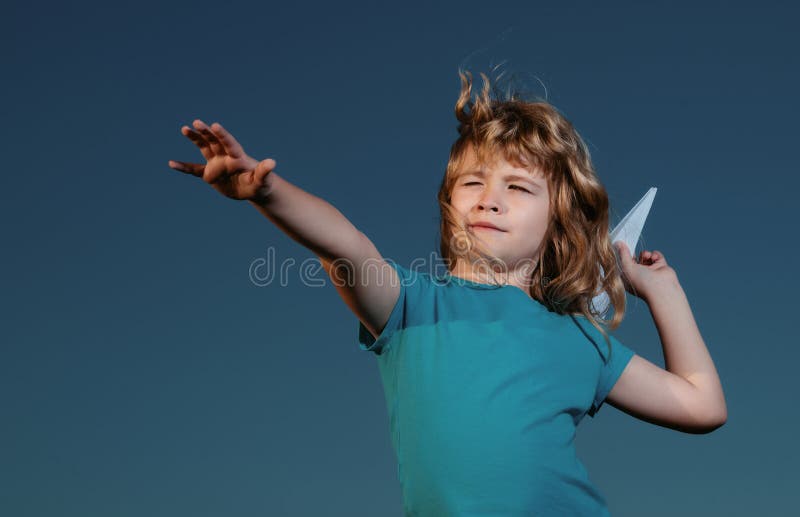 Kid Boy Throwing a Paper Plane with Blue Sky Background. Stock Image ...
