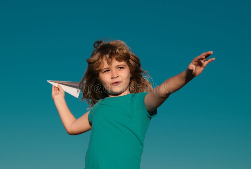 Kid Boy Throwing a Paper Plane with Blue Sky Background. Stock Image ...
