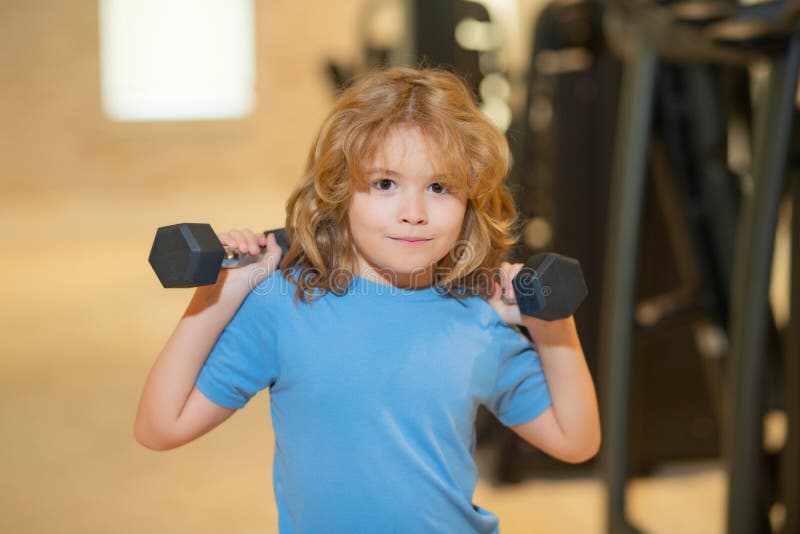 Kid Boy Working Out with Dumbbells. Sport and Kids Training. Stock ...