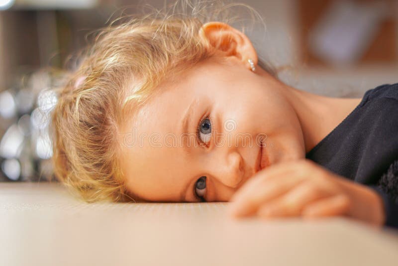 Kid Captured in a Portrait Smiling and Lying Down Stock Photo - Image ...