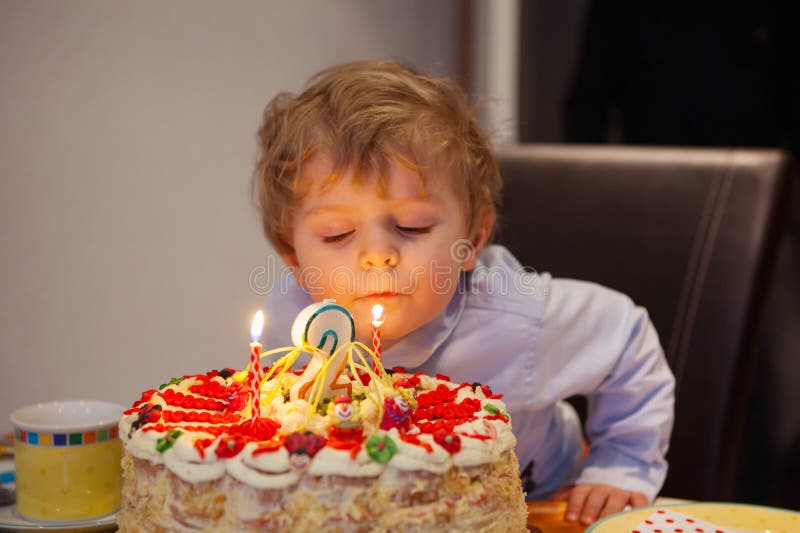 Blowing Out Candles On A Birthday Cake
