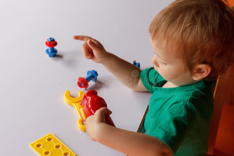 Kid Child Boy Playing with Toys Stock Photo - Image of leisure, actions ...