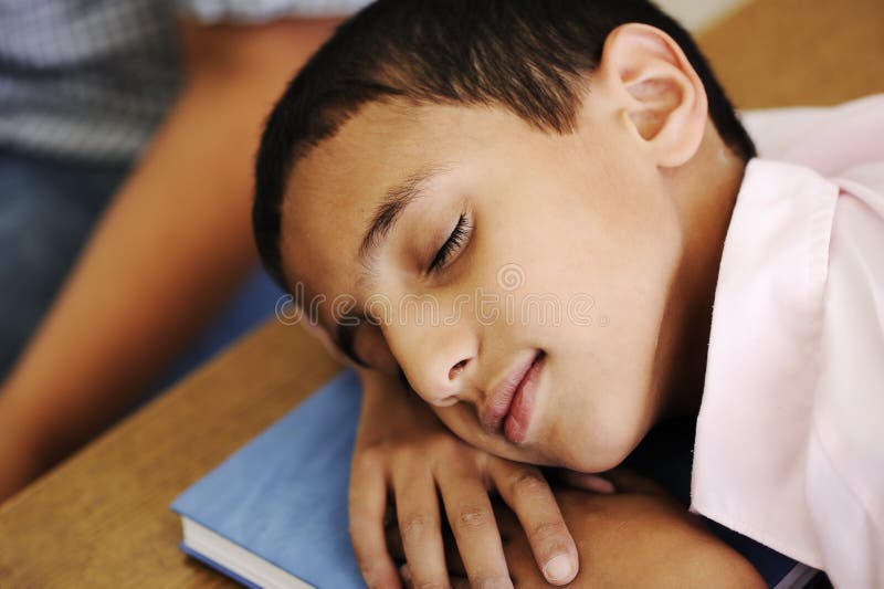 Kid in Classroom on Desk Falling Asleep Stock Photo - Image of educate ...